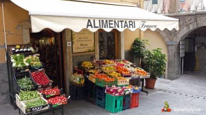 Picturesque grocery shops and other typical food and wine shops across ...